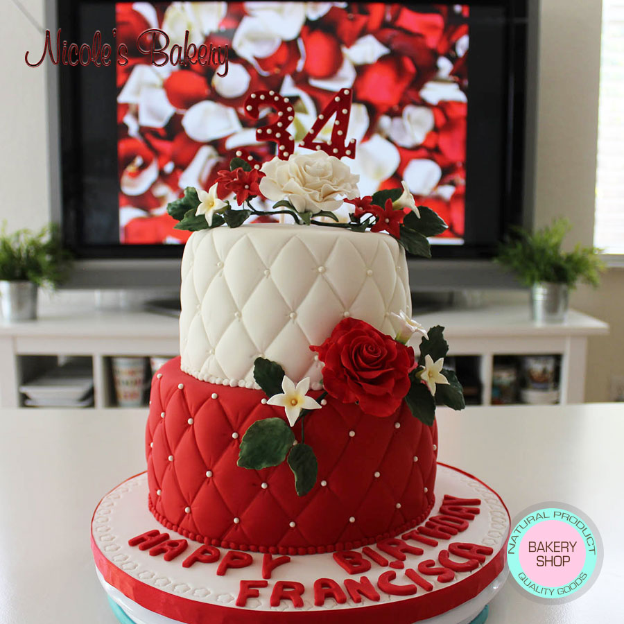 Elegant white and red cake with gum paste roses.